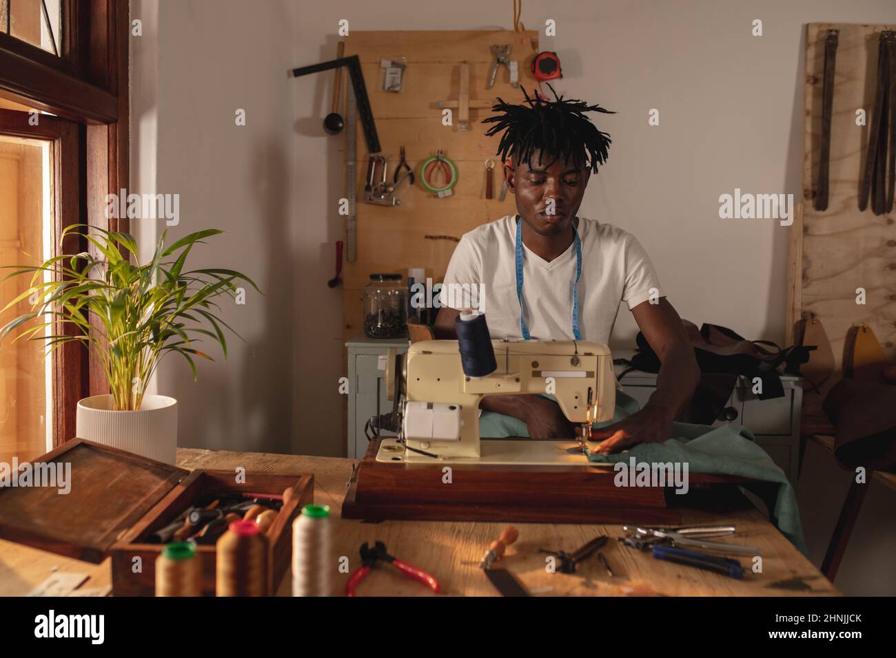 African tailor in his workshop hi-res stock photography and images - Alamy