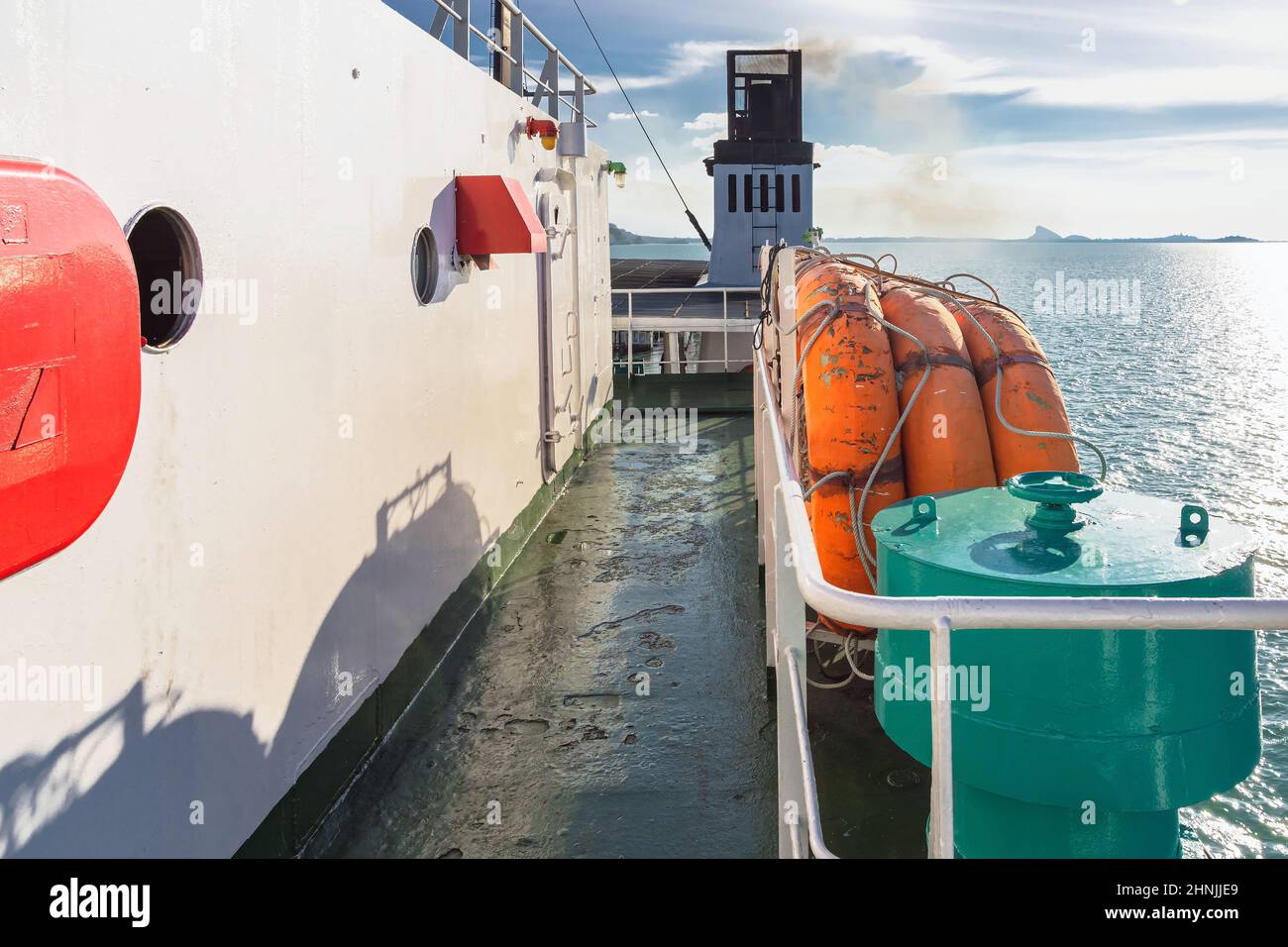 Orange inflatable lifeboats on ferry deck for emergencies and maritime ...