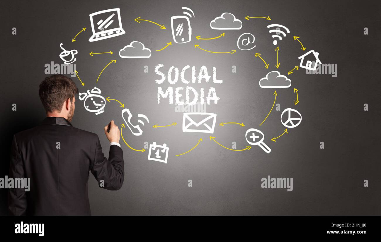 businessman drawing social media icons Stock Photo - Alamy