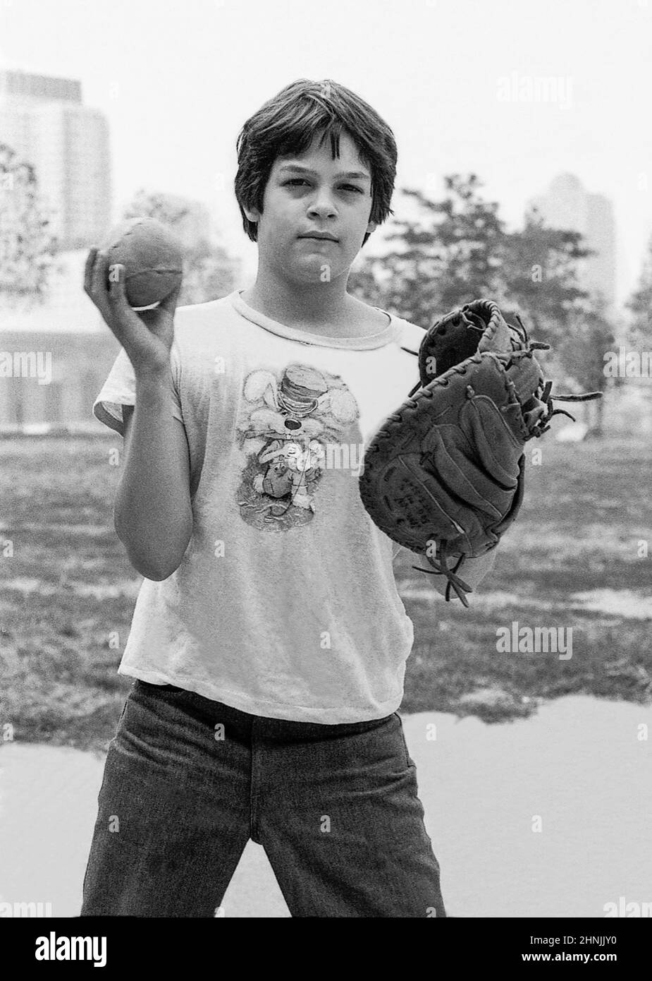 Young New York guy with baseball equipment on a sports field in ...