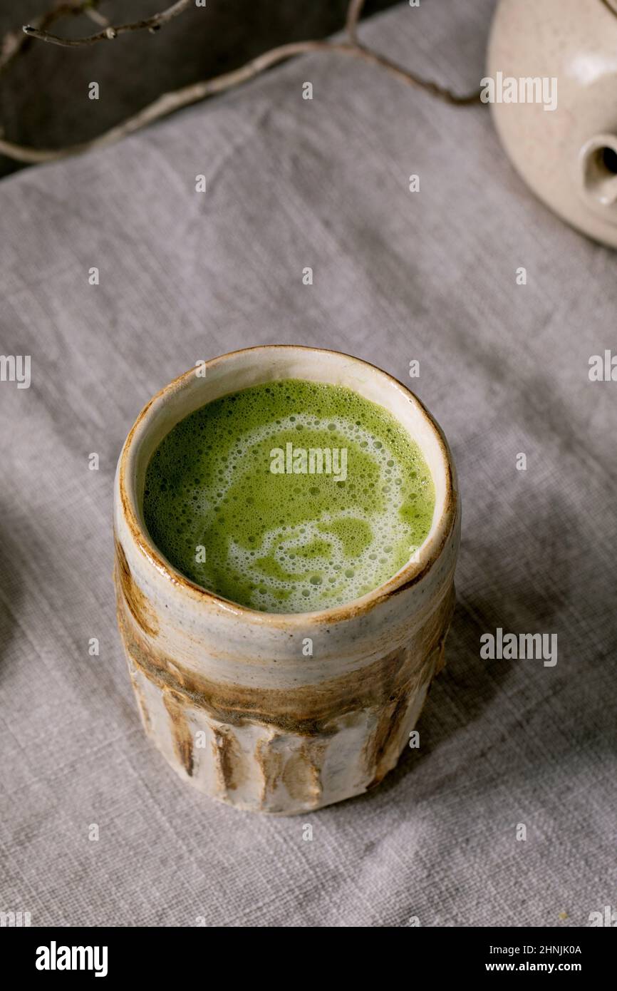 Traditional japanese hot green tea latte in handmade ceramic cup hi-res ...