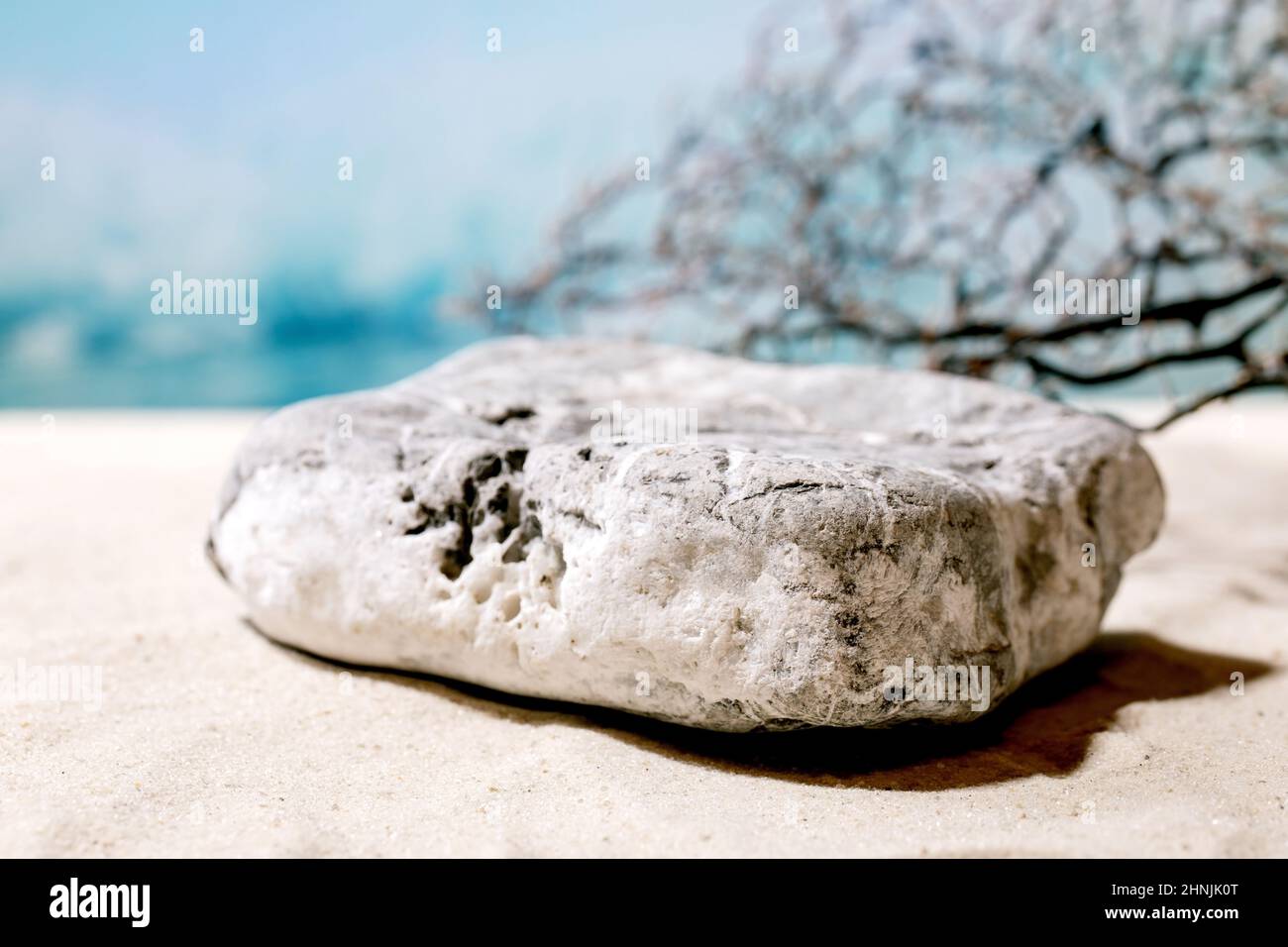 Summer sand sea beach with waves and flat stone as display podium for ...