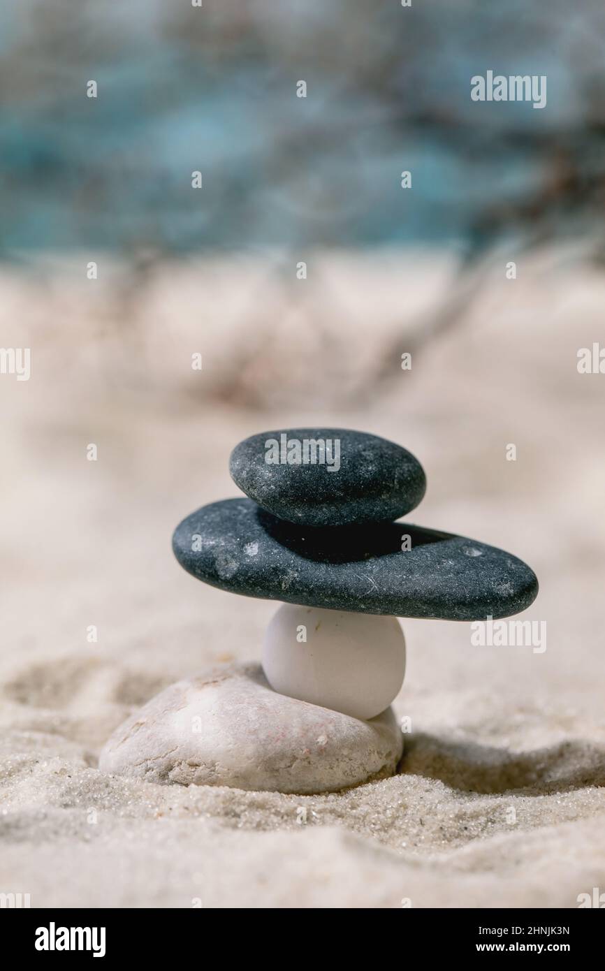 Stack of different smooth stones in balancing composition on summer ...