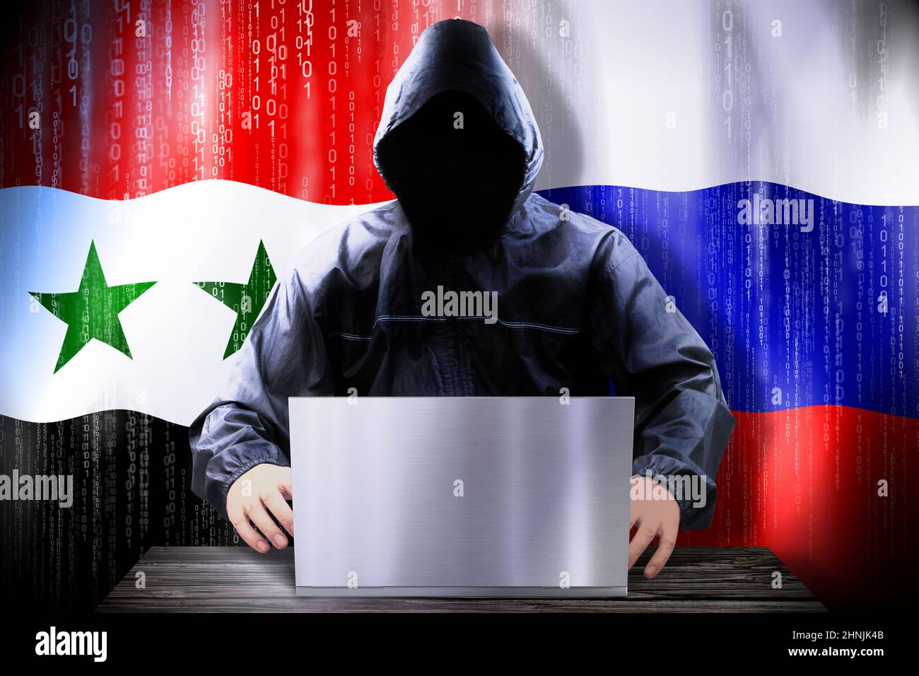Anonymous hacker working on a laptop, flags of Syria and Russia Stock ...