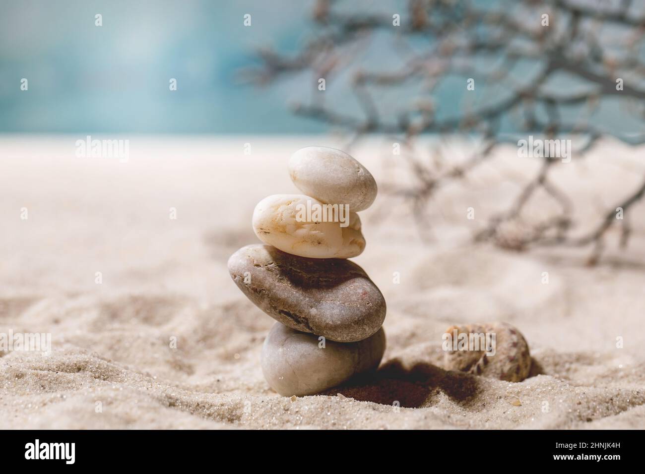 Stack of different white smooth stones in balancing composition on ...