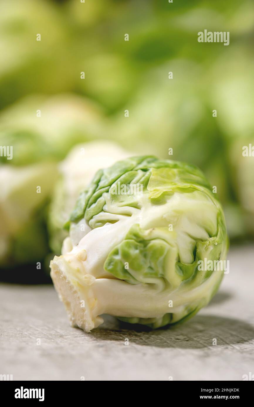 Macro peeled raw organic brussels sprouts mini cabbage. Food background ...