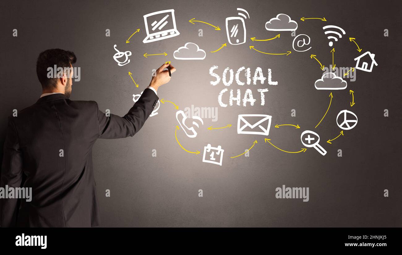 businessman drawing social media icons Stock Photo - Alamy