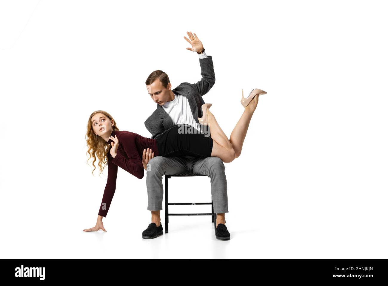 Harassment. Young people, office workers in business style suits ...