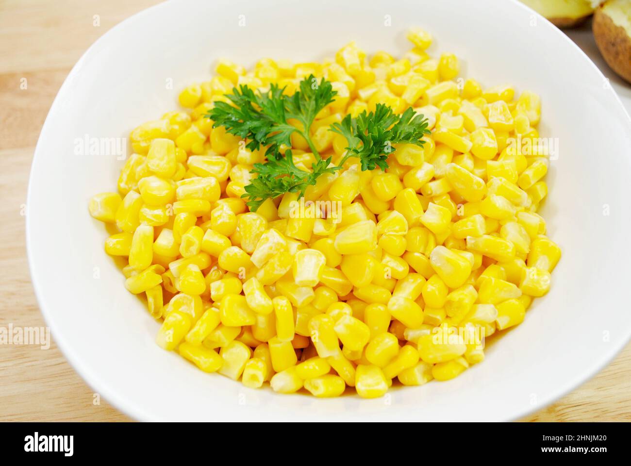 A side dish of sweet yellow corn in a white hi-res stock photography ...