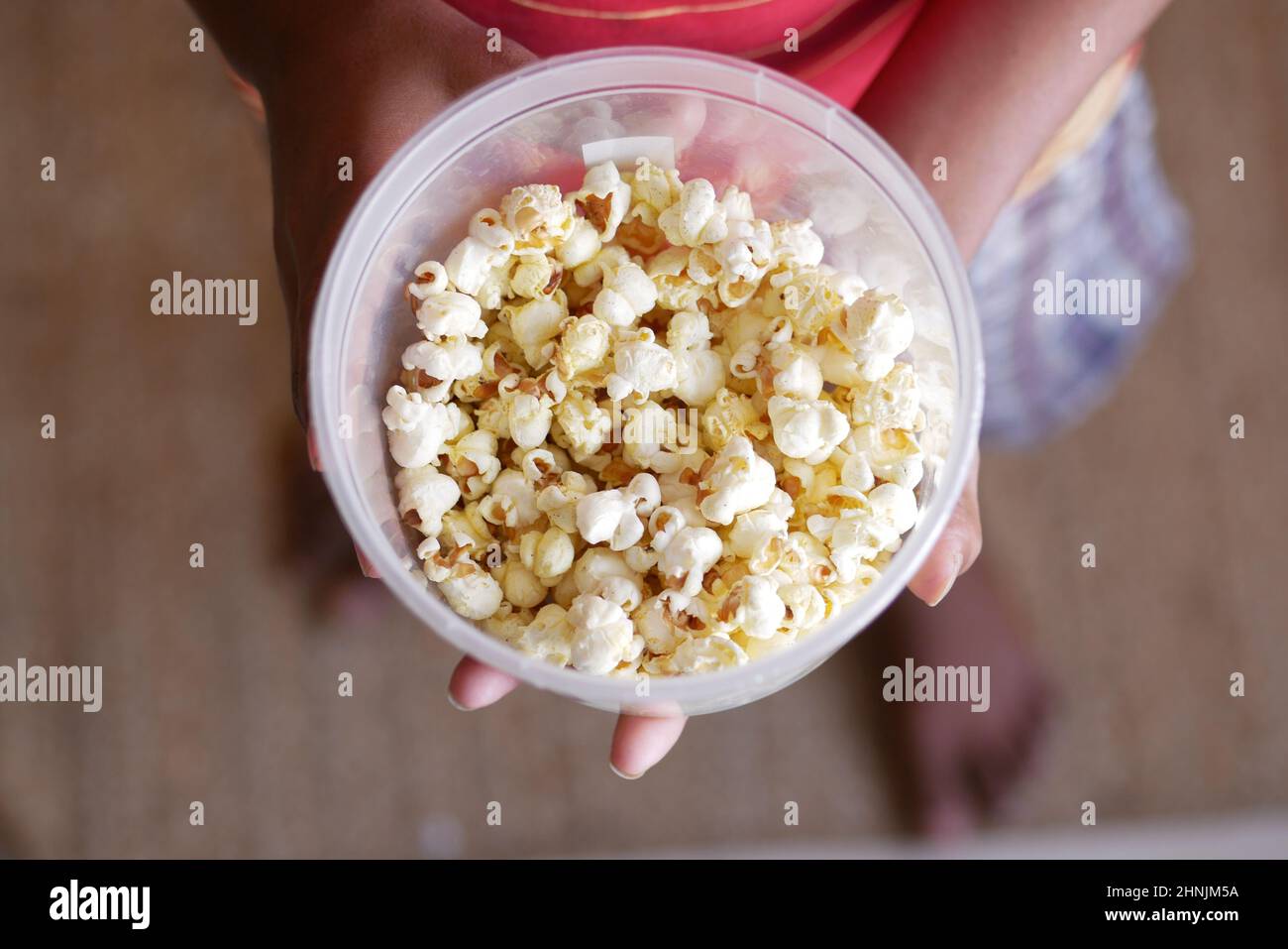 young man eating popcorn close up Stock Photo - Alamy