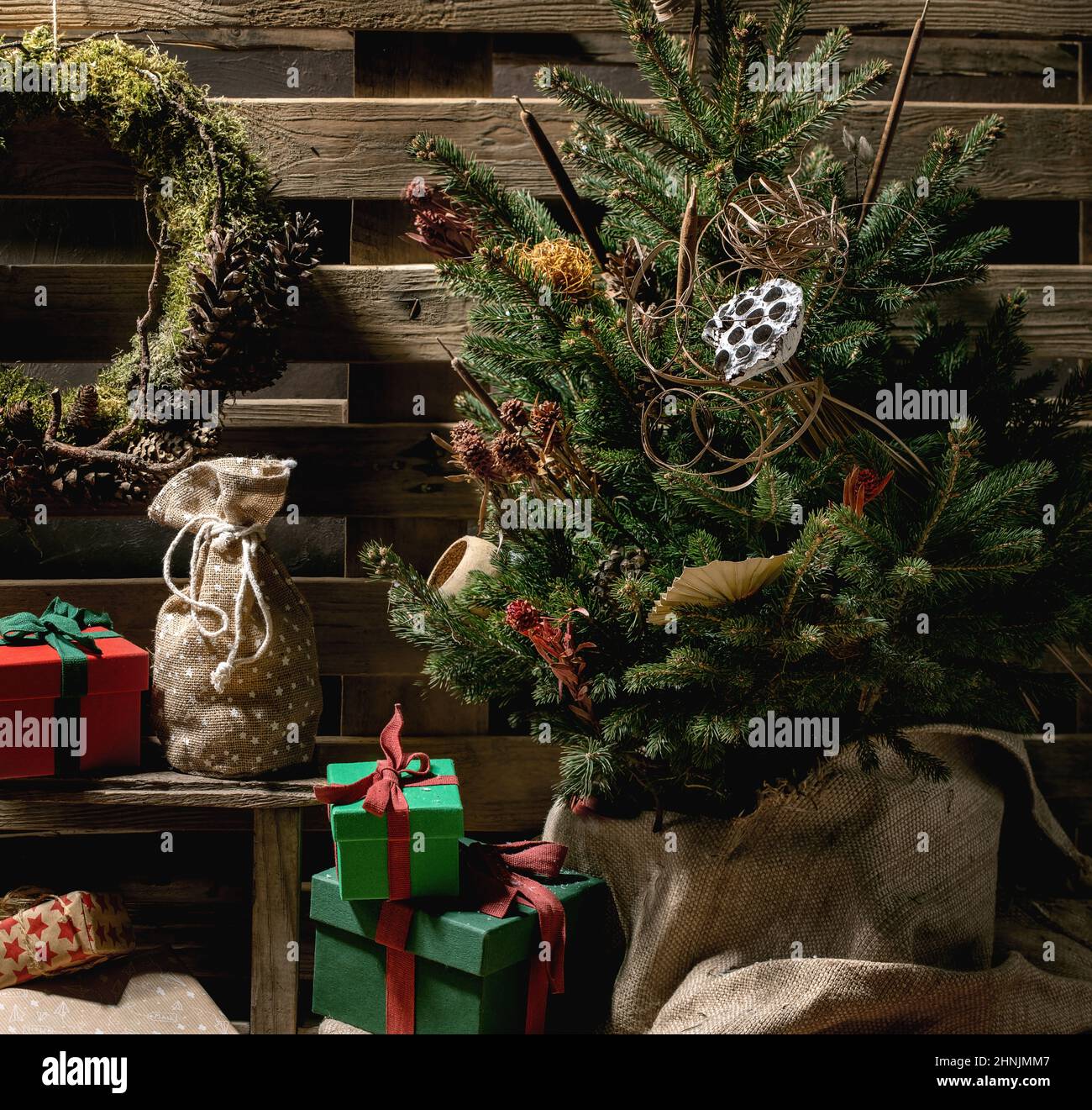 Christmas fir tree with dried flowers in Christmas fashion rustic style ...