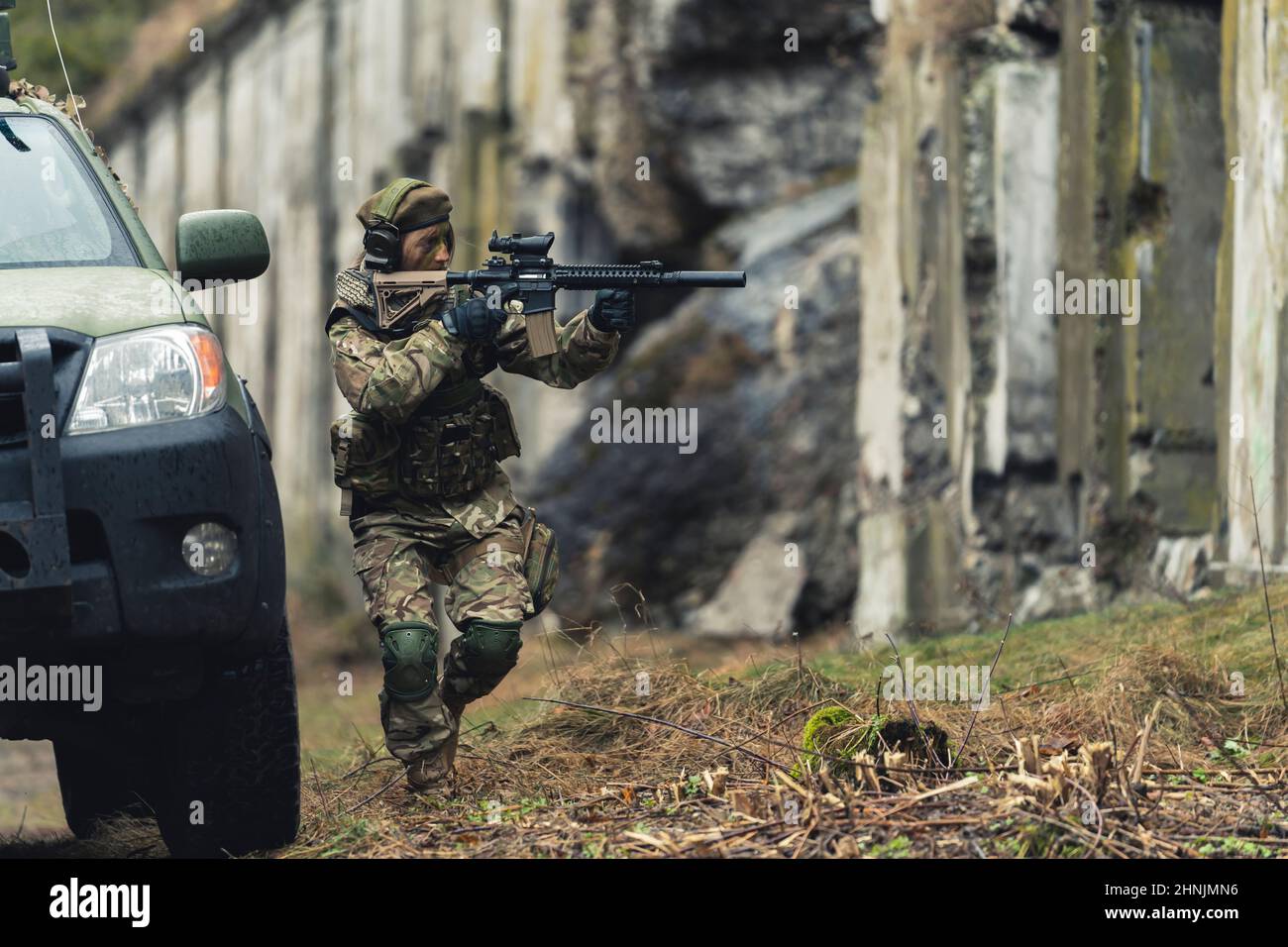 Defenseless solo female soldier falling weak on battlefield . High ...