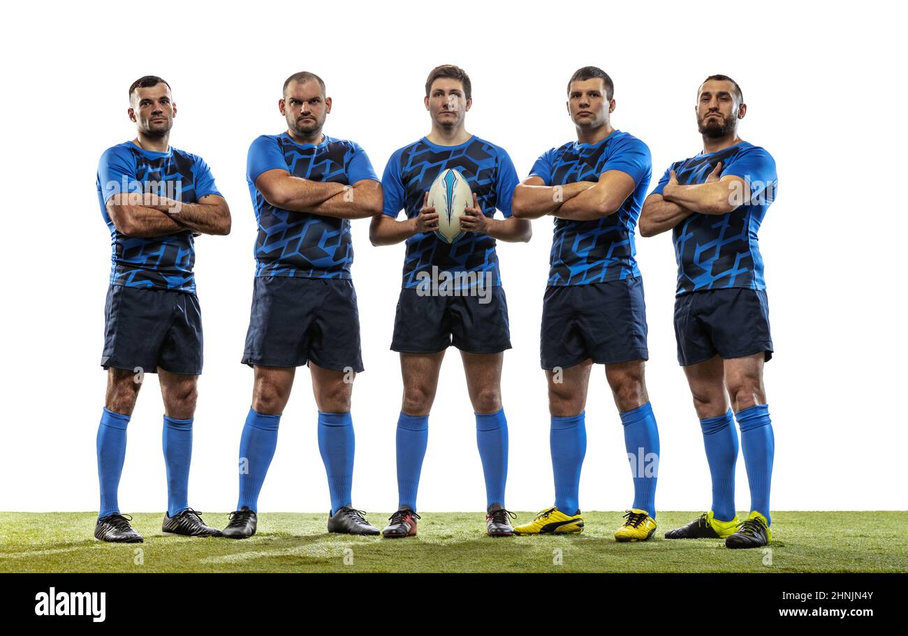Group portrait of strong athletes, rugby players standing together like ...