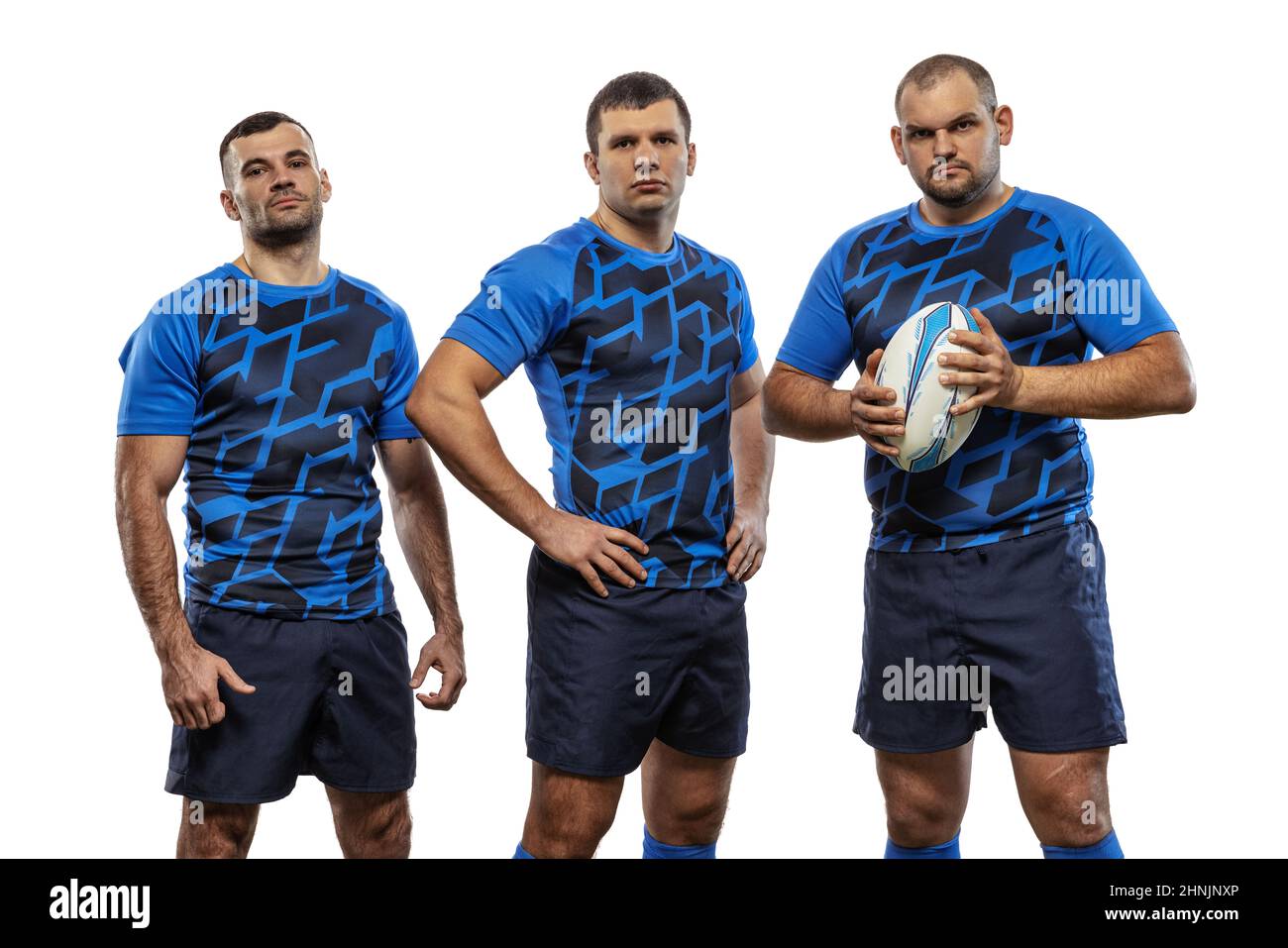 Group portrait of strong athletes, rugby players standing together like ...