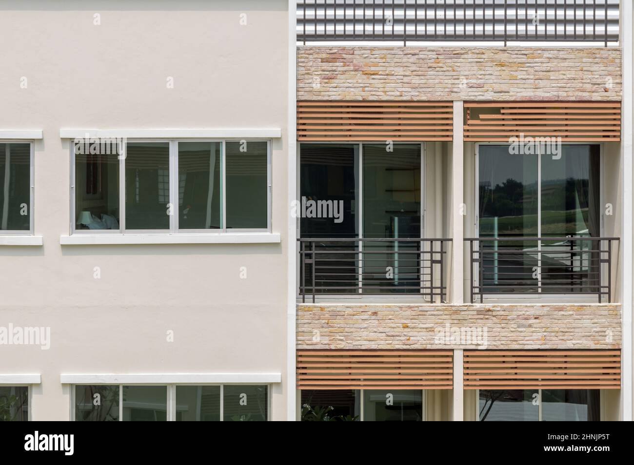 Closeup balconies and windows of apartment building Stock Photo - Alamy
