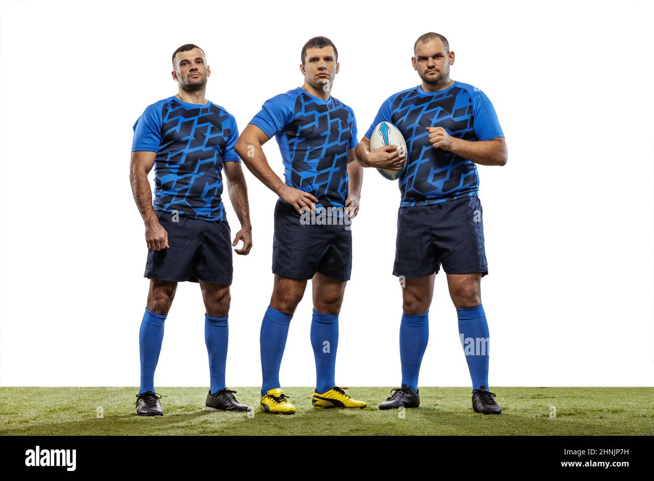 Group portrait of strong athletes, rugby players standing together like ...