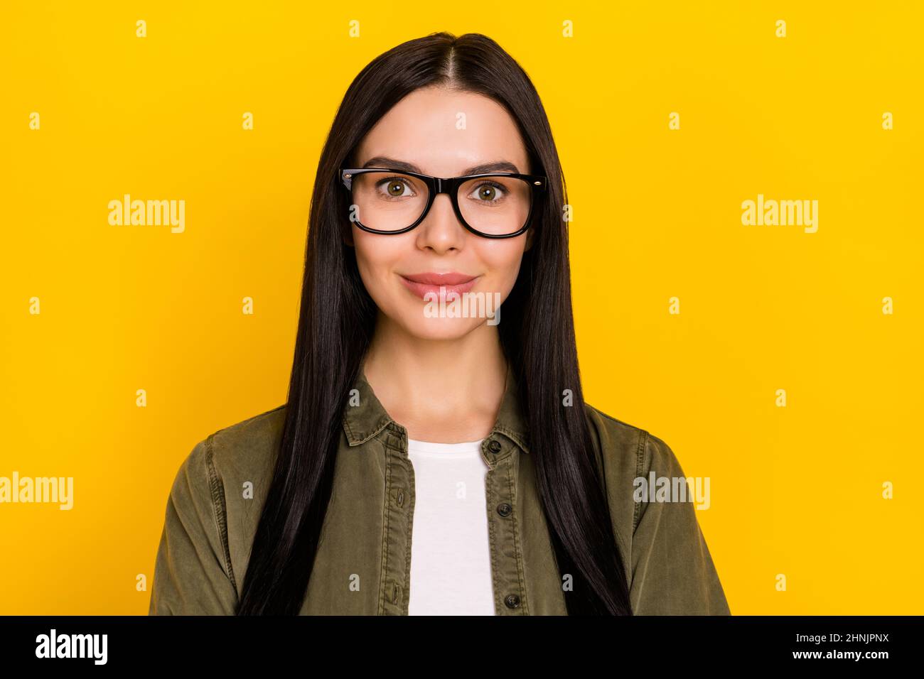 Photo of cute millennial lady wear eyewear outfit isolated on yellow ...