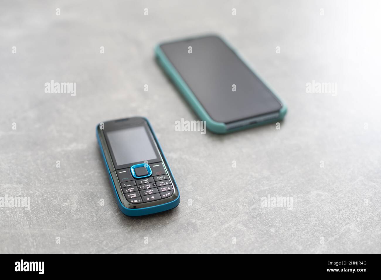 Second generation digital technology. smart phone and old technology ...