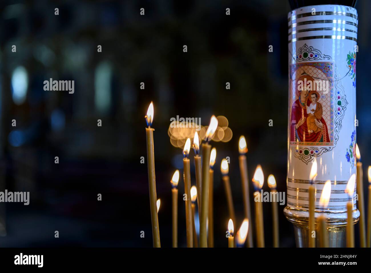 Church candles on the background of icons in Russian orthodox cathedral ...