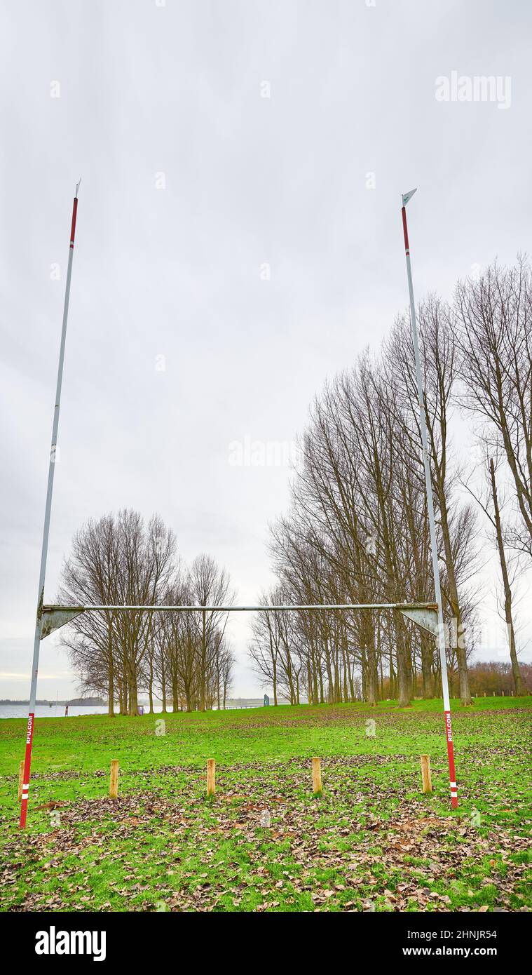 Rugby goal posts on a field by a lake in the middle of nowhere Stock ...