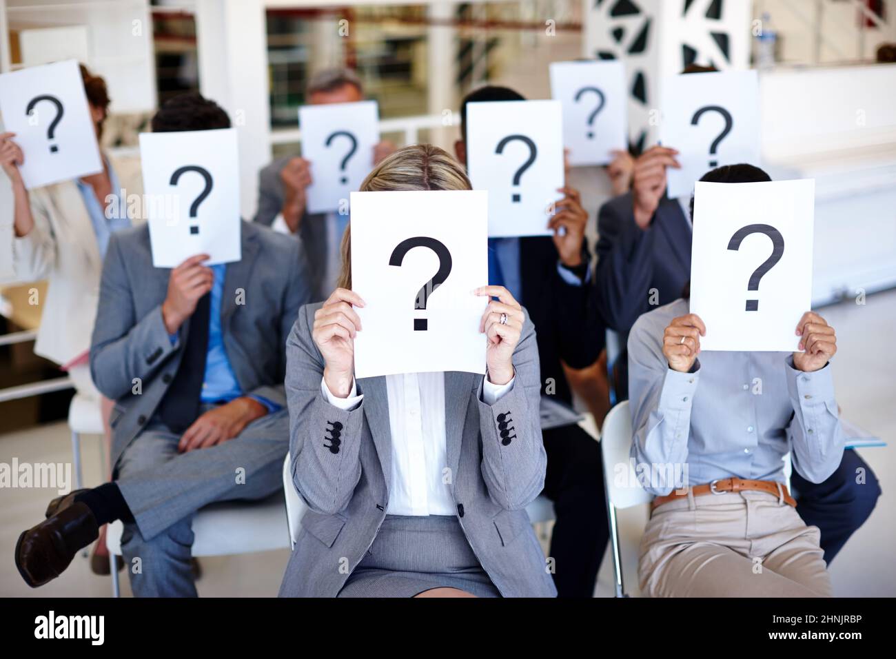 Business team holding question marks hi-res stock photography and ...