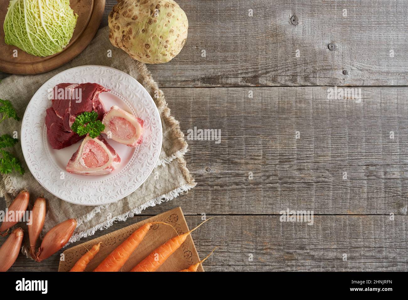 Ingredients for preparing beef broth or soup - fresh marrow bones and ...