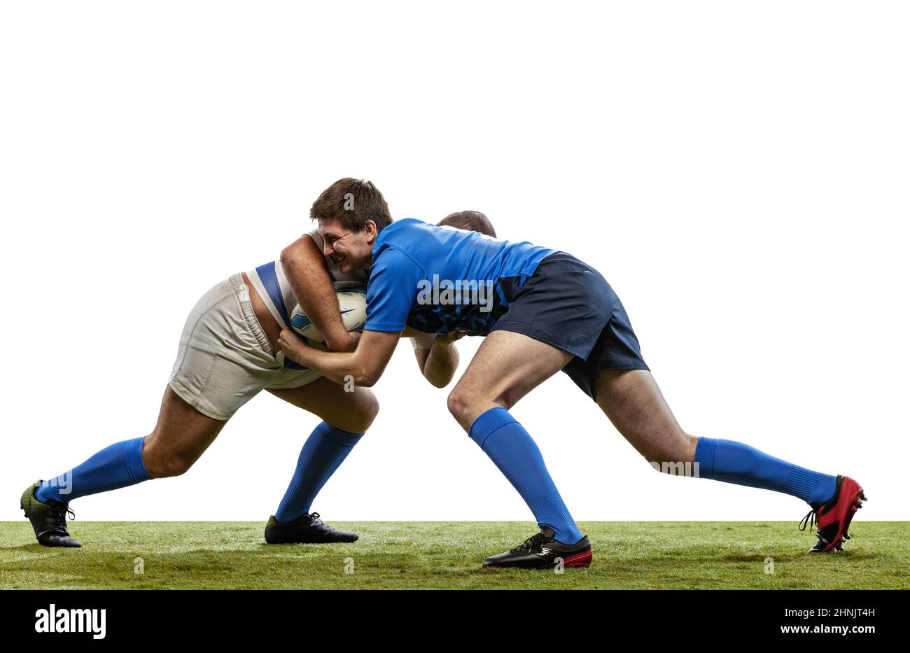 Two athletes, rugby players playing rugby football on grass flooring ...