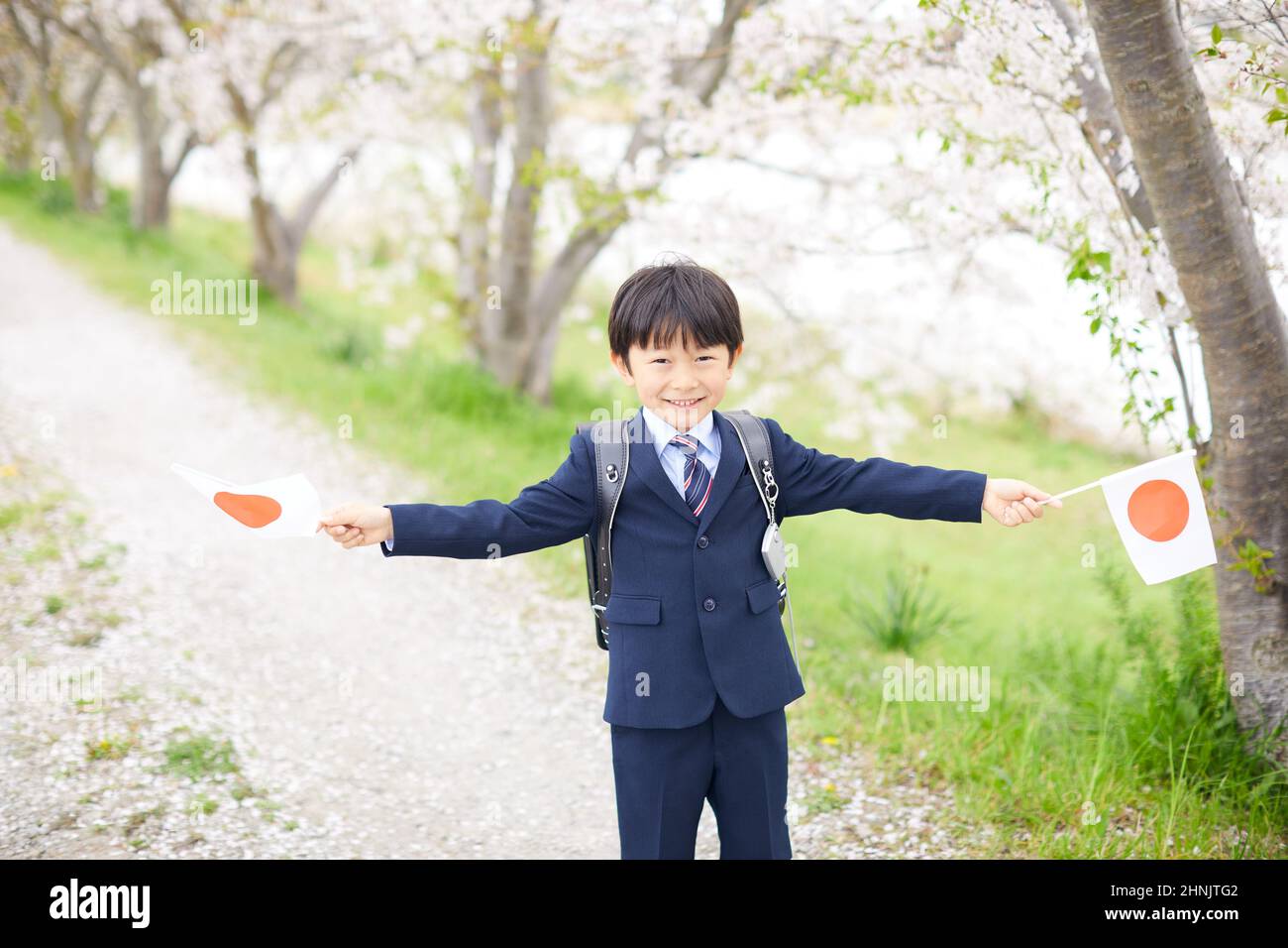 Japanese Elementary School Boy Holding A Japanese Flag Stock Photo - Alamy