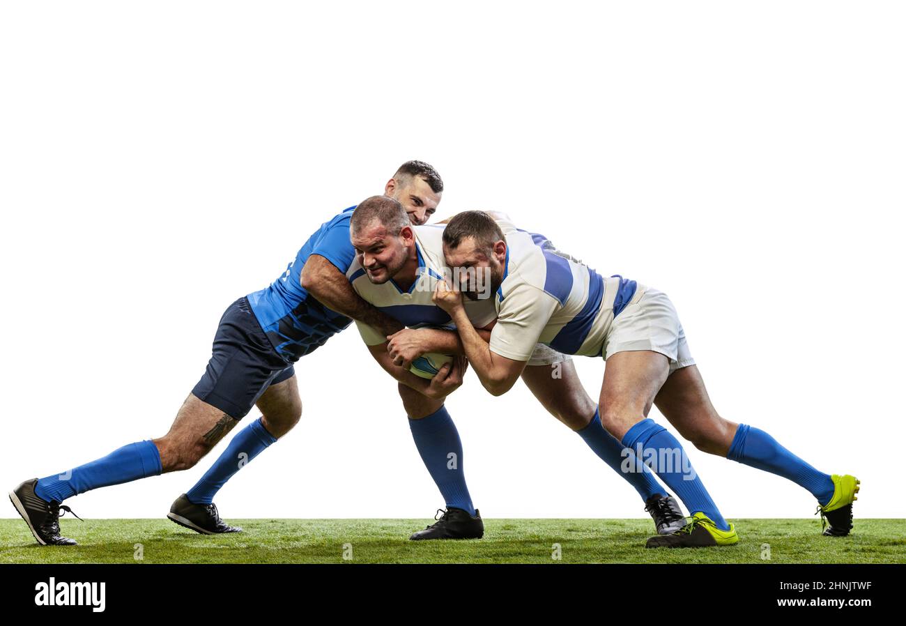Sportive men, professional rugby players playing rugby football on ...