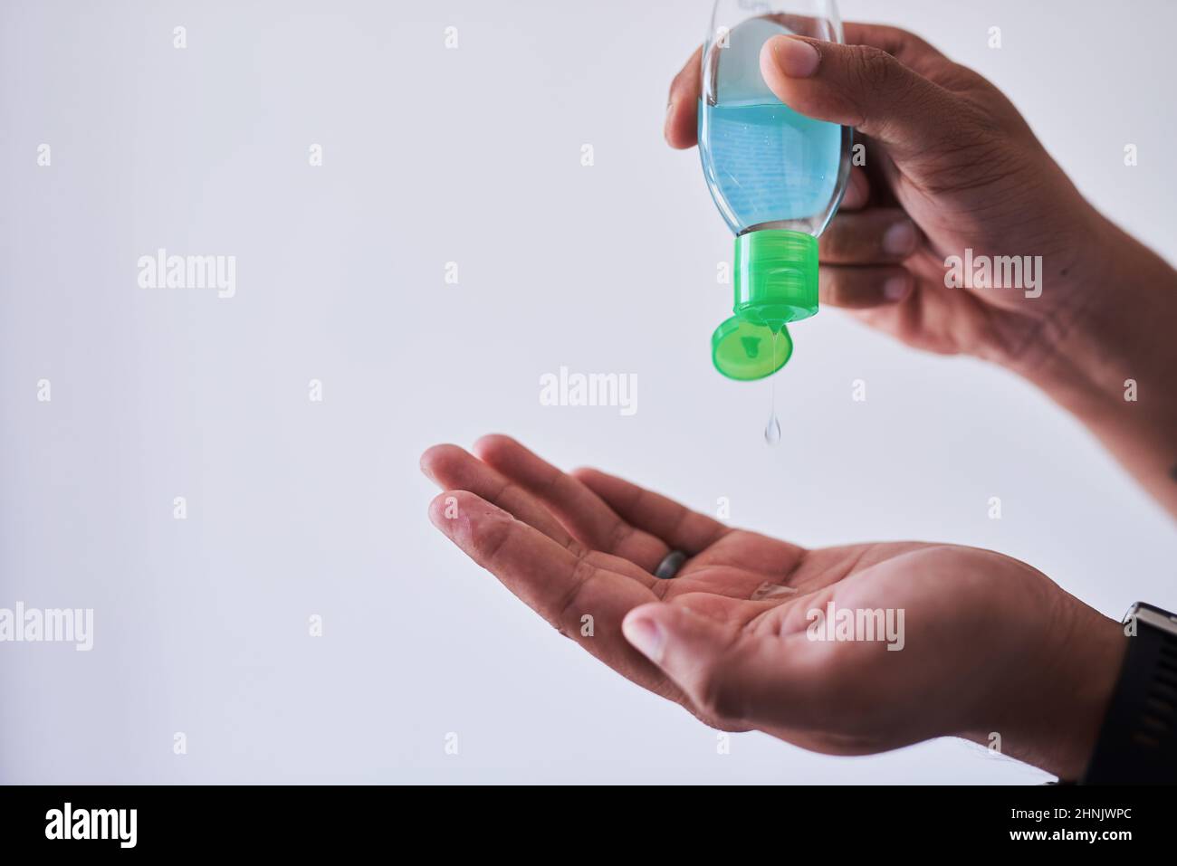 Hand squeezing bottle hi-res stock photography and images - Alamy