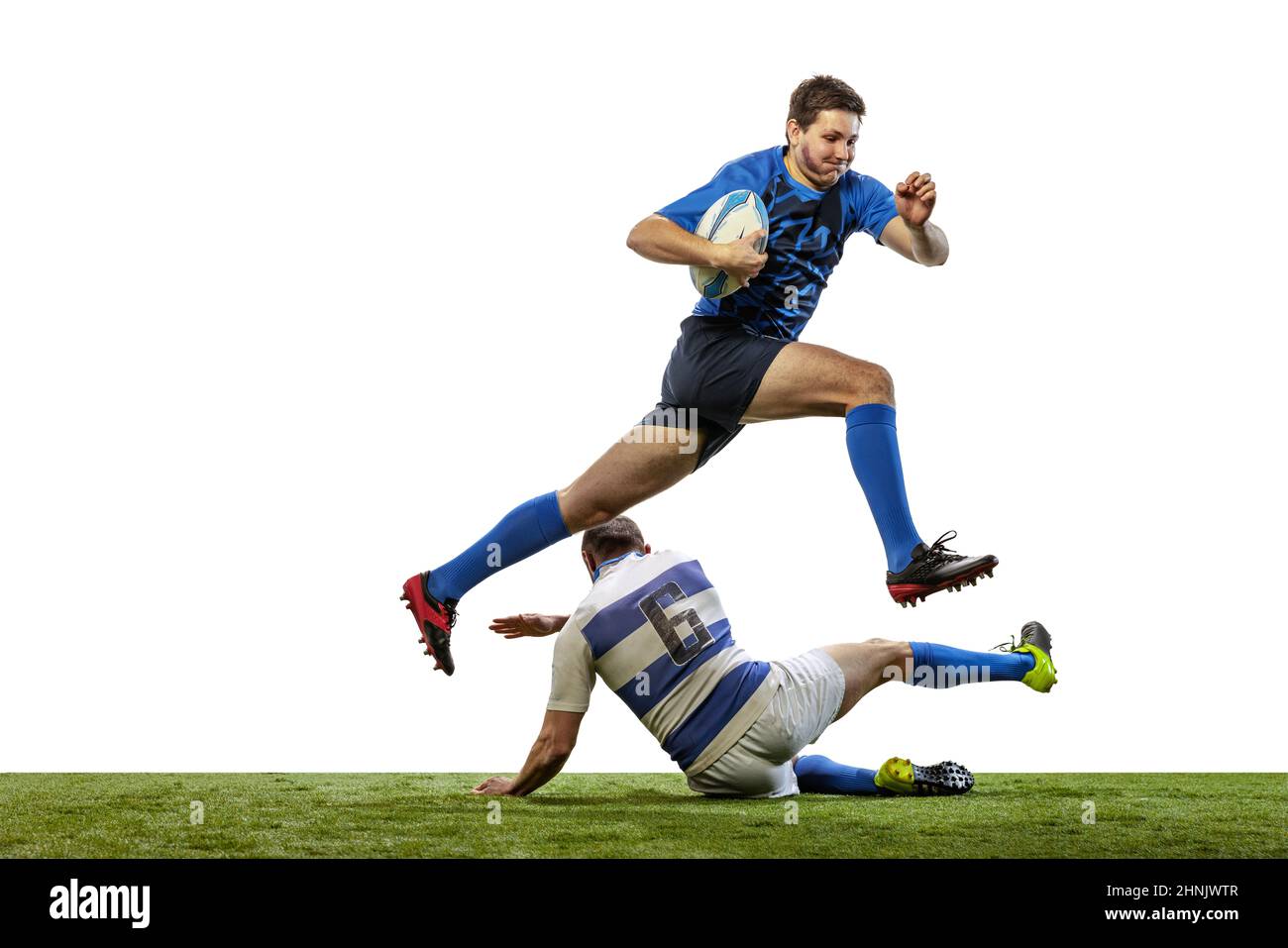 Two athletes, rugby players playing rugby football on grass flooring ...