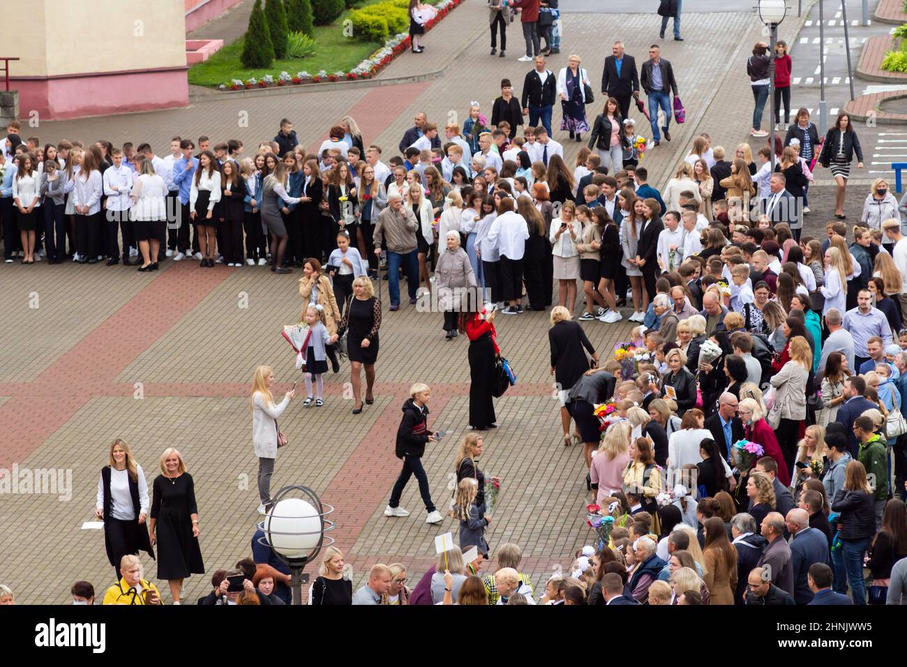 Meeting and rally of children and adults near the school on the street ...
