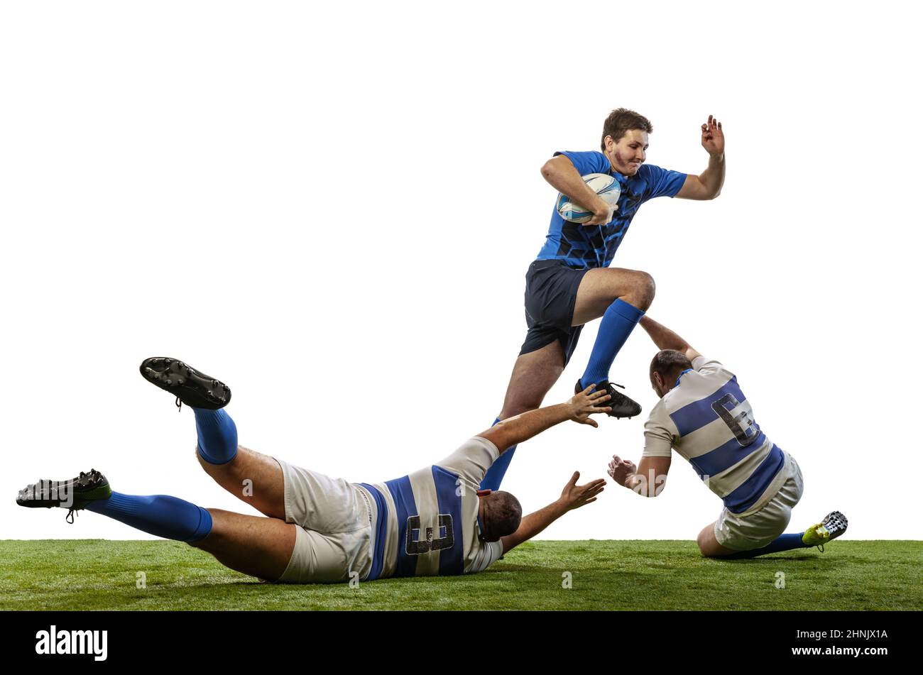 Muscled men, professional rugby players playing rugby football on grass ...