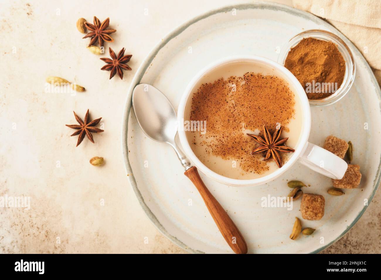Masala tea. Masala chai spiced tea with milk and spices on light warm ...