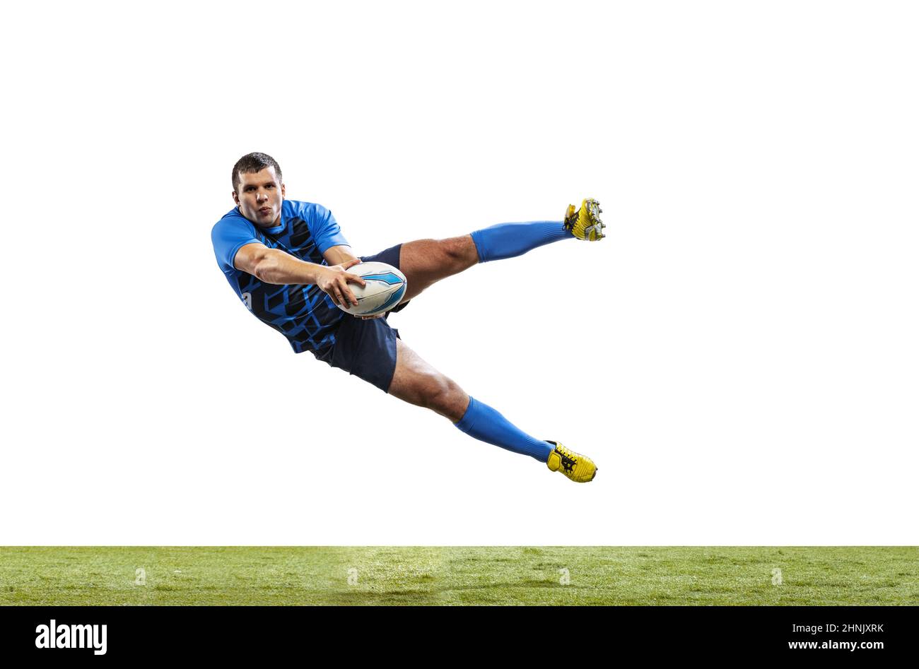 One man, rugby player catching ball in jump isolated on white ...