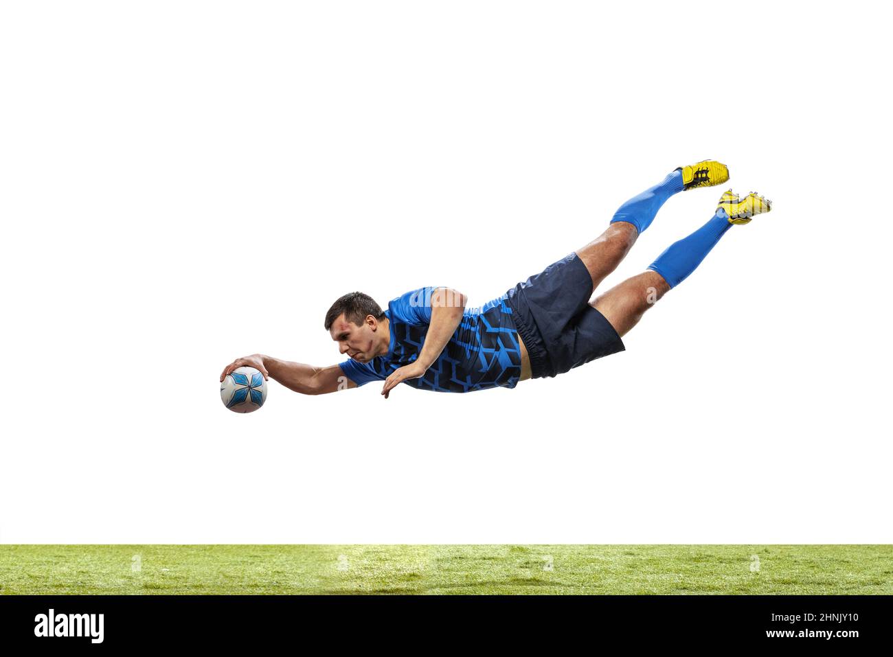 One man, rugby player catching ball in jump isolated on white ...