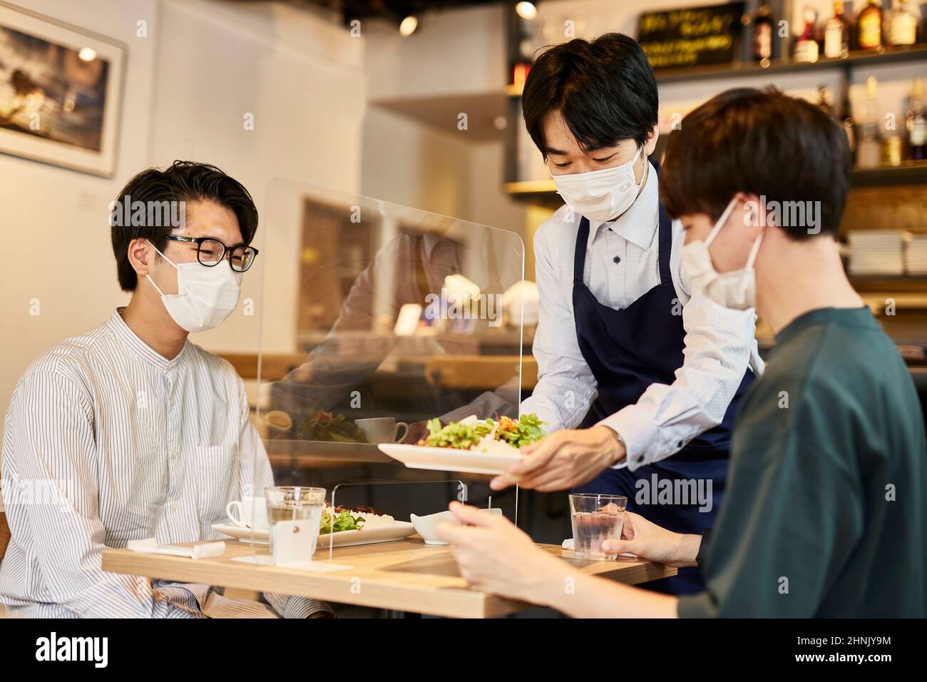 Japanese Male Waiter Serving Food Stock Photo - Alamy