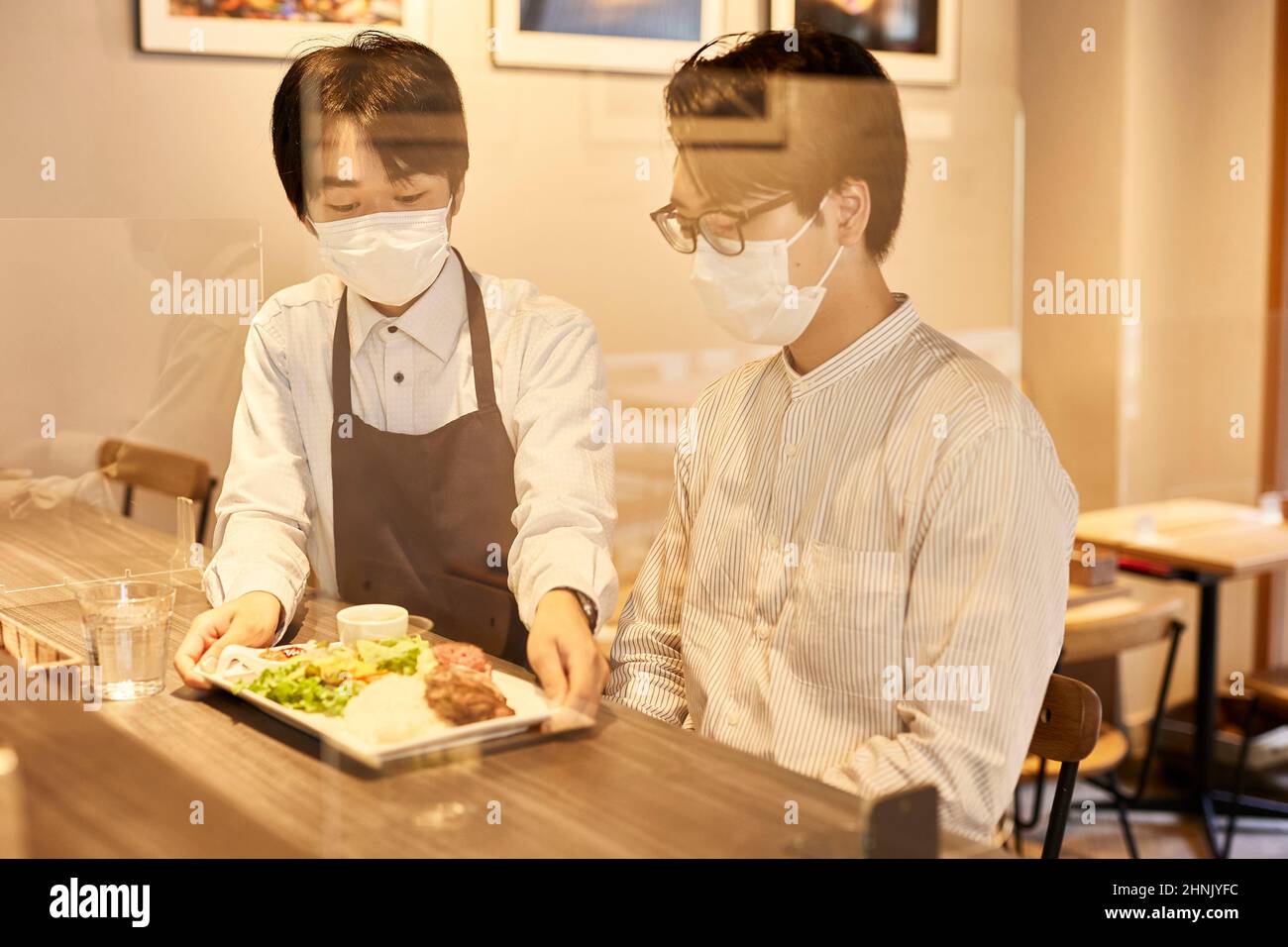 Japanese Male Waiter Serving Food Stock Photo - Alamy