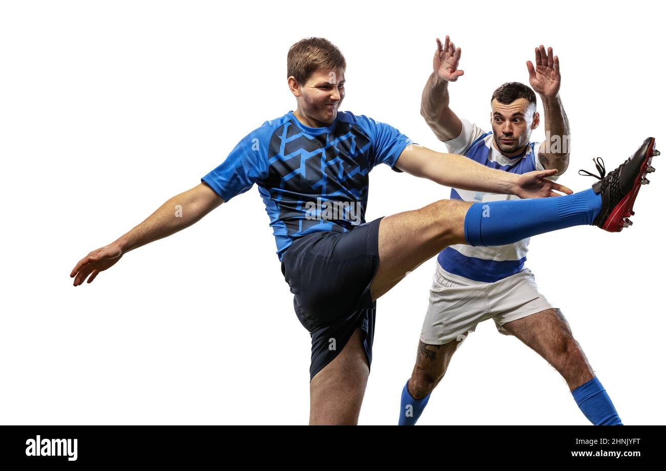 Two athletes, rugby players playing rugby football on grass flooring ...