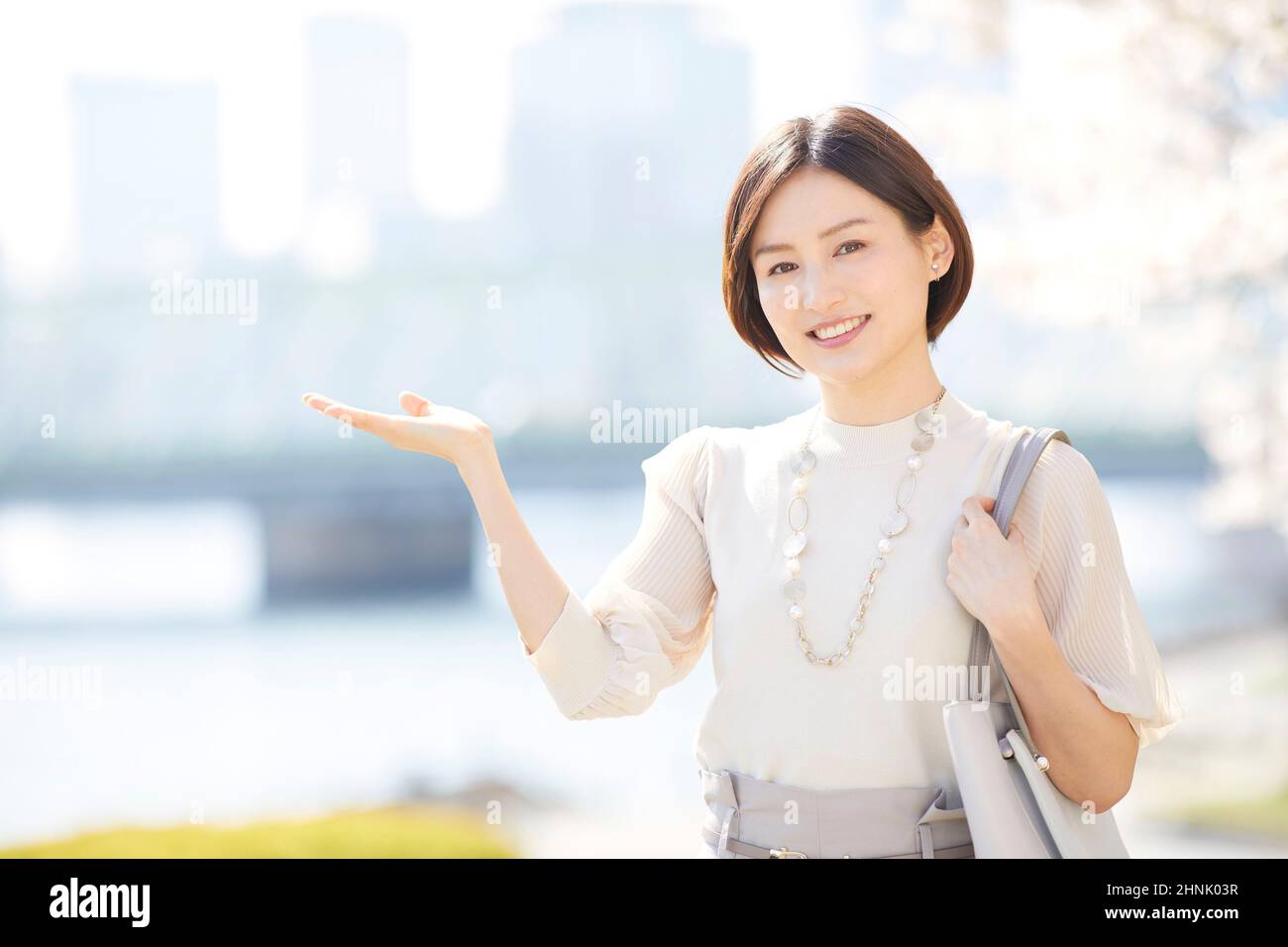 Young Japanese Woman Making Hand Sign Stock Photo - Alamy