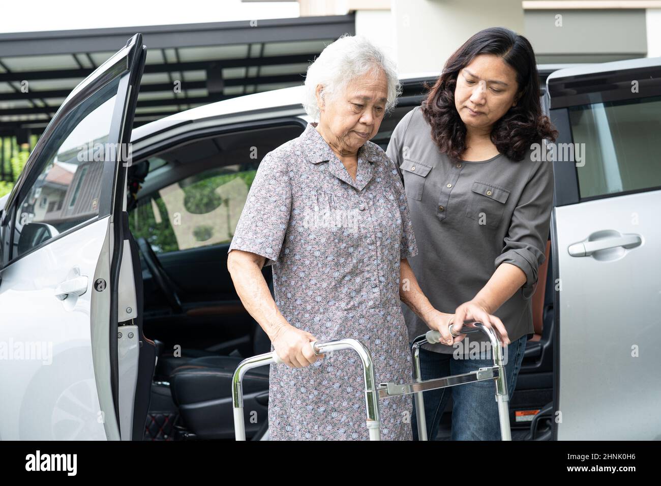 Help and support asian senior or elderly old lady woman patient walk ...