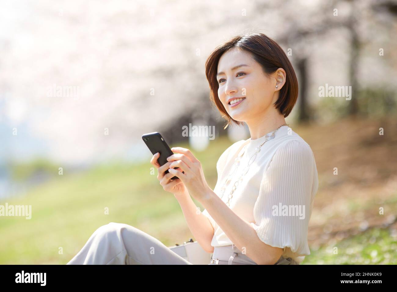 Young Japanese Woman Operating A Smartphone Stock Photo - Alamy