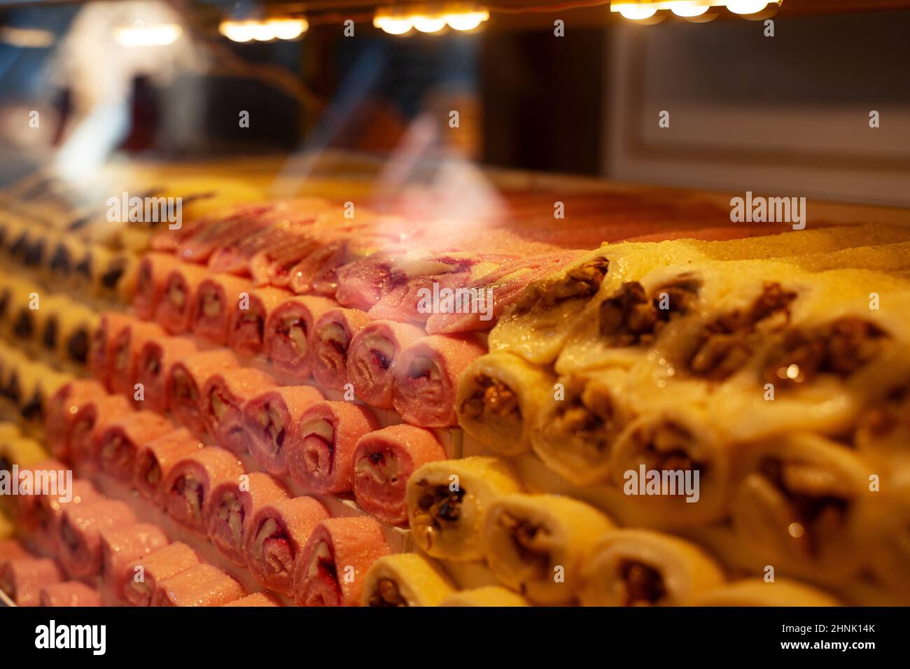 rows of Turkish delight sweets desserts with dried fruits arranged in a ...