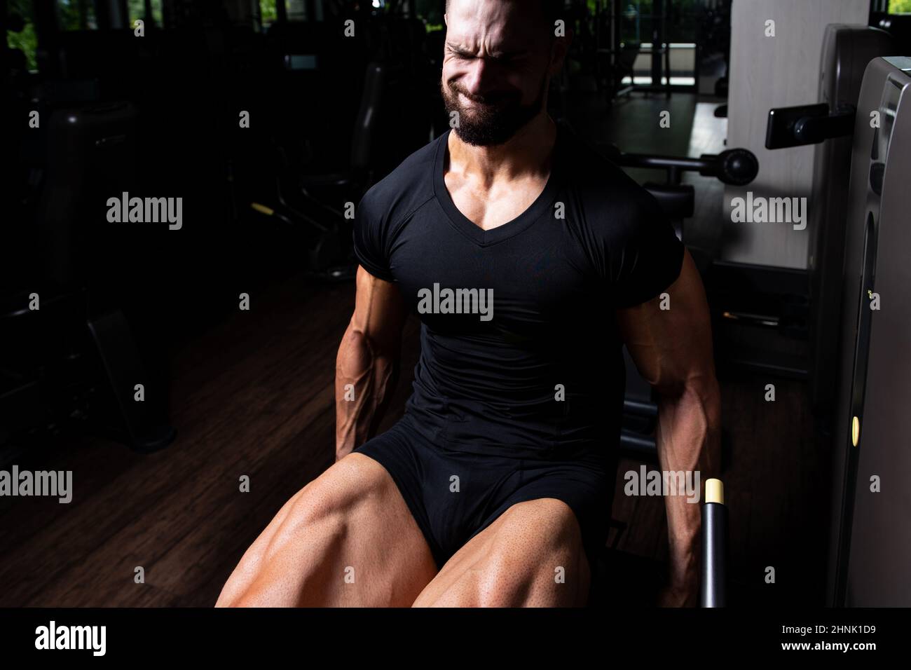 Workout Leg Exercises In Gym Stock Photo - Alamy