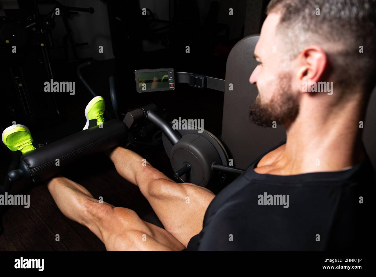 Workout Leg Exercises In Gym Stock Photo - Alamy