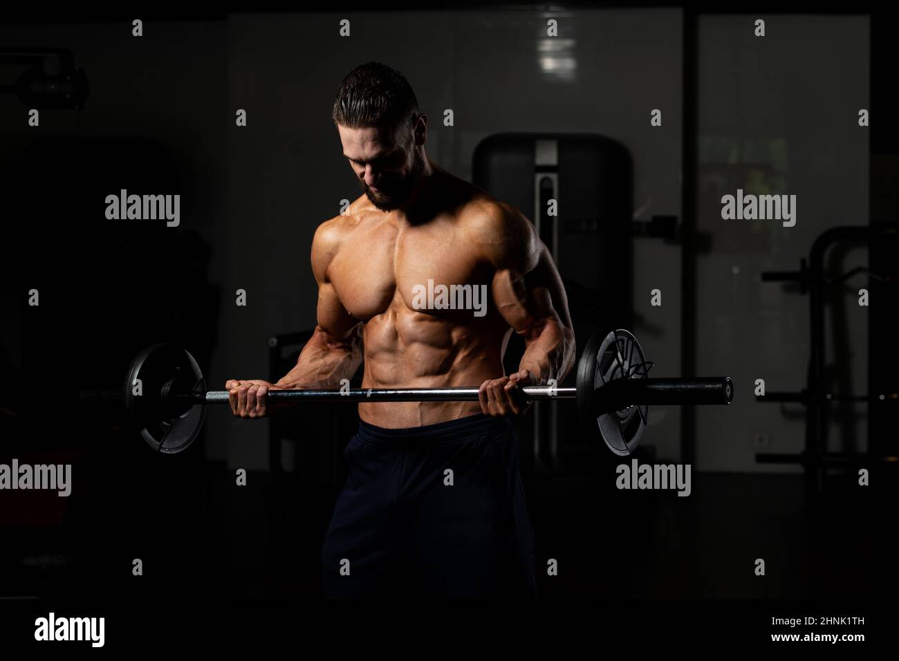 Biceps Exercise With Barbell Stock Photo - Alamy