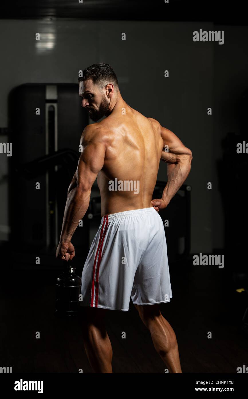 Bodybuilder Drinking Water From Shaker Stock Photo - Alamy