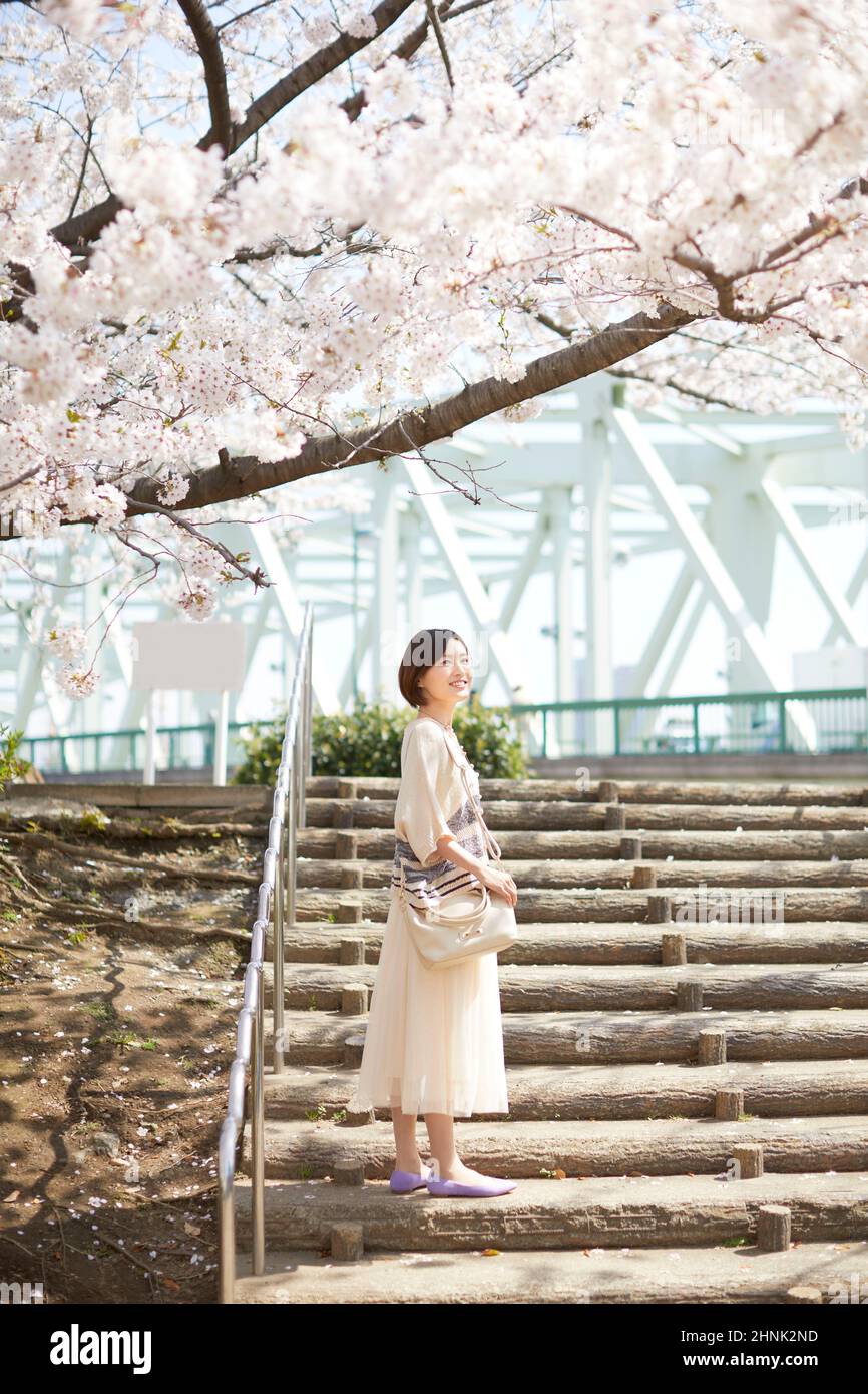 Young Japanese Woman Standing On The Stairs Stock Photo - Alamy
