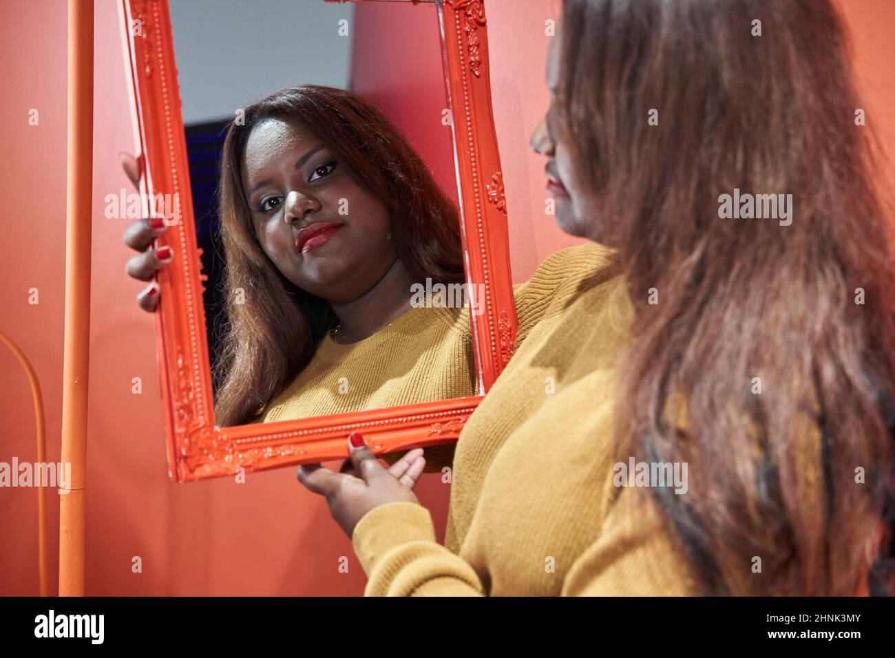 Woman looking into a mirror hi-res stock photography and images - Alamy