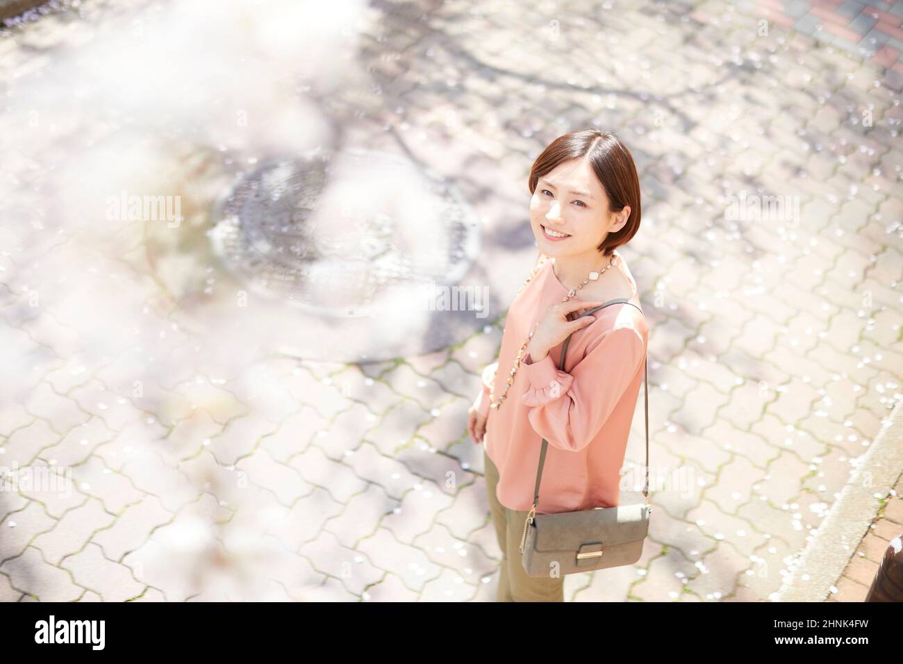 Young Japanese Woman Turning Around With A Smile Stock Photo - Alamy